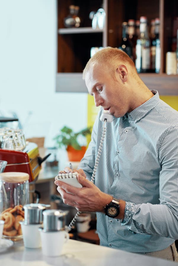 Young Man Writing Order of Client in Cafeteria Stock Photo - Image of ...