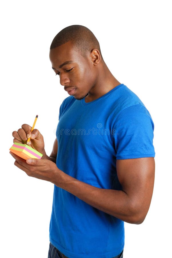 Young Man Writing on Pack of Post Its Notes Stock Photo - Image of ...