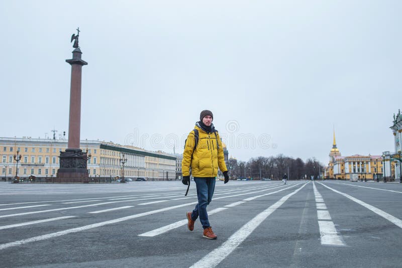 Young Man in Yellow Jacket Walking on the Road. Empty Dvortsovaya ...