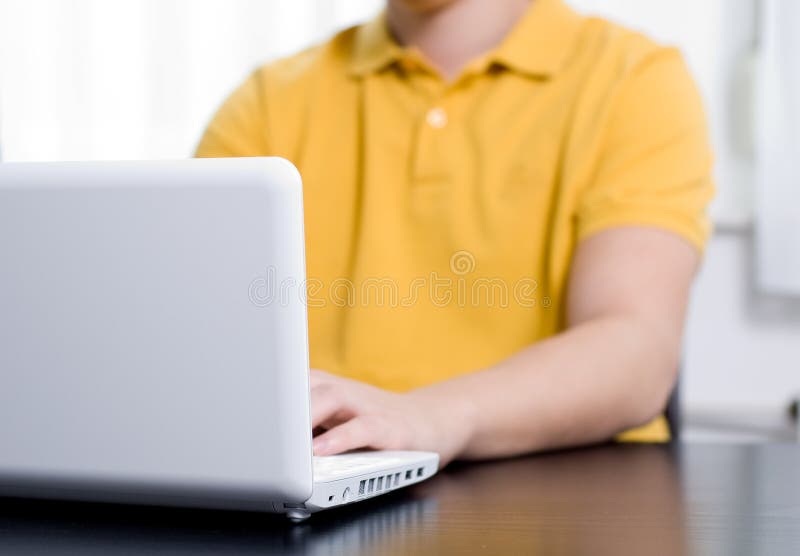Young Man in Yellow Shirt Types on Notebook Stock Photo - Image of ...