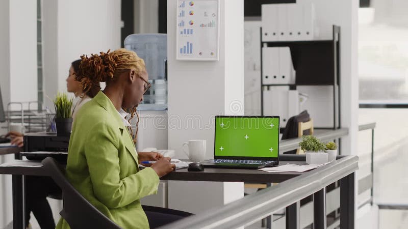 Young Manager Analyzing Greenscreen Template on Laptop Stock Footage ...