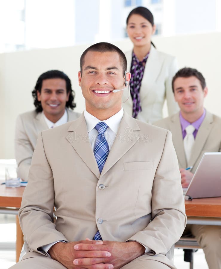 Young Manager With Headset On In Front Of His Team Stock Image - Image ...
