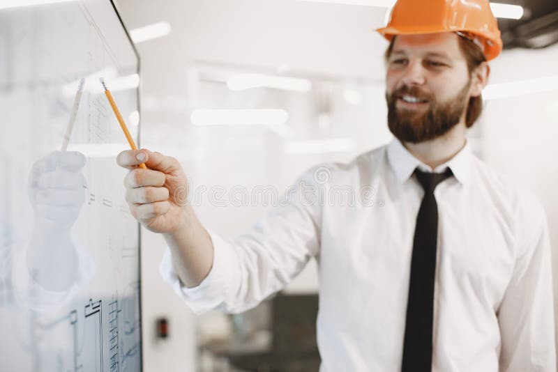Young Manager in the Office with Helmet Stock Photo - Image of ...