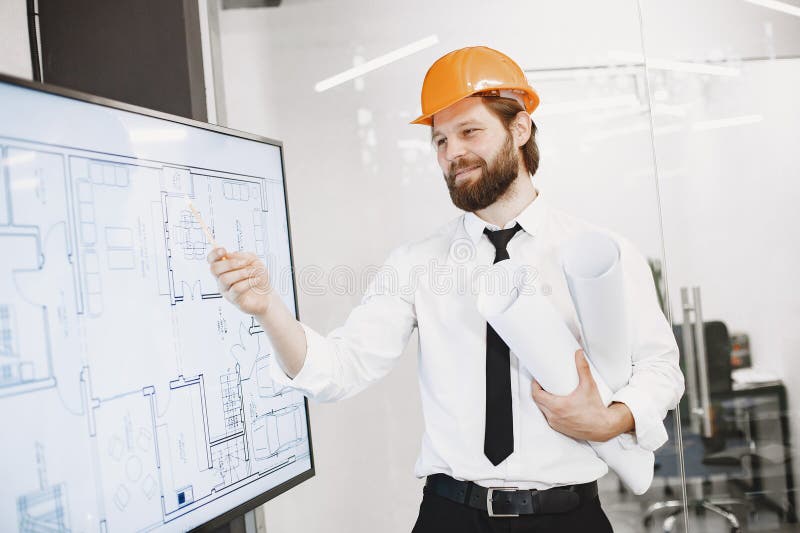 Young Manager in the Office with Helmet Stock Photo - Image of design ...