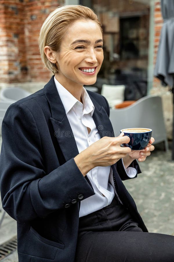 Young Manager Working and Having Morning Coffee in a Street Cafe Stock ...