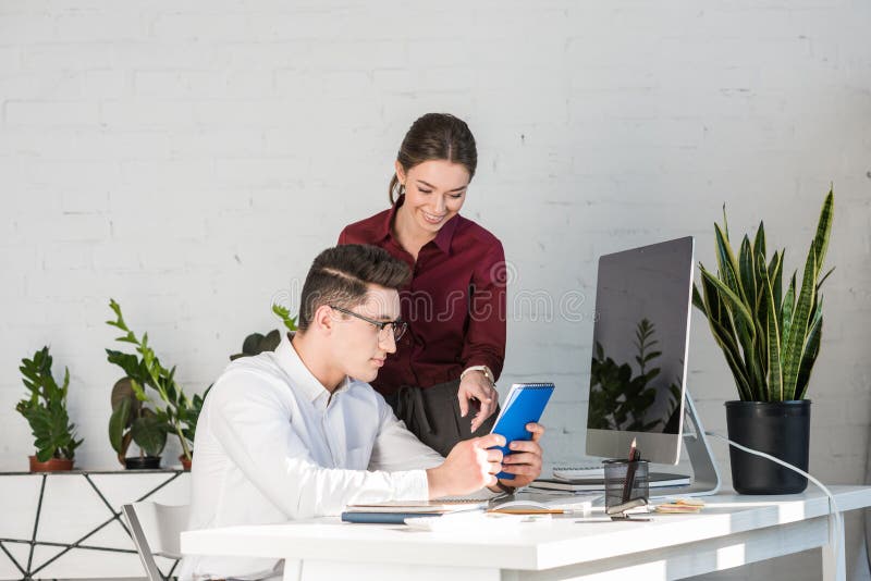 Young Managers Working Together at Workplace Stock Photo - Image of ...