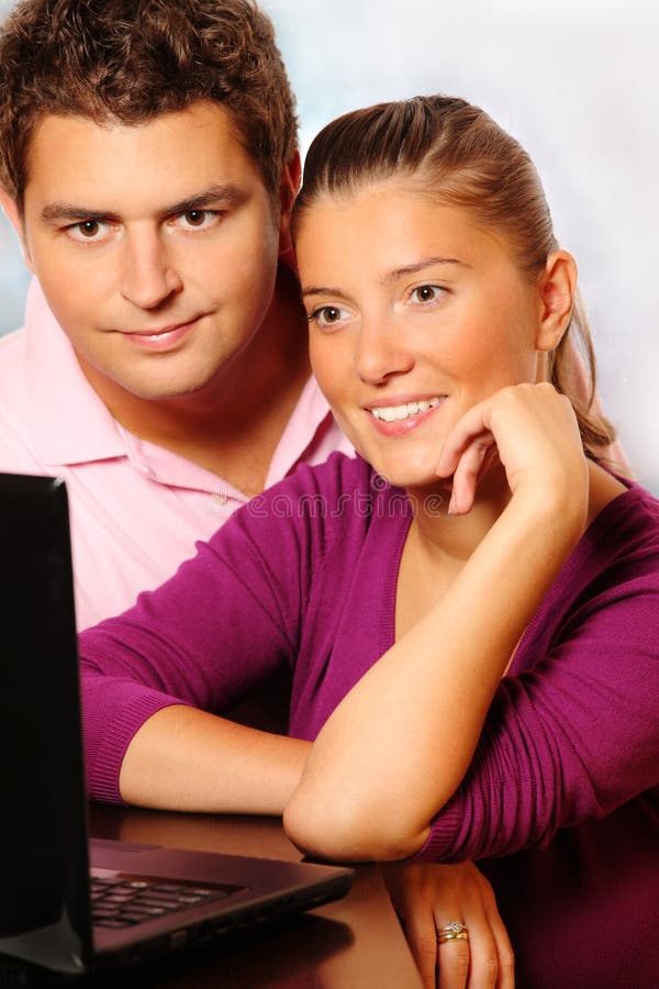 Young Married Couple Searching the Internet Stock Image - Image of room ...