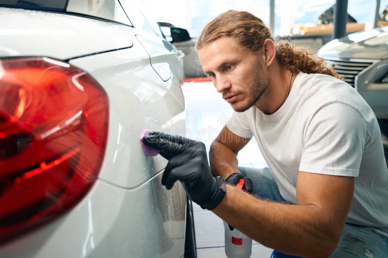 Young Master Uses Special Clay in Car Detailing Stock Photo - Image of ...