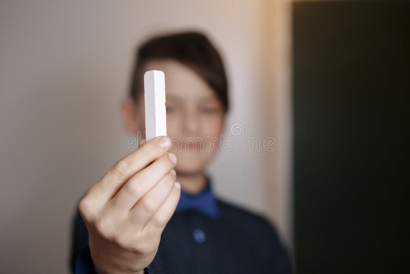 Young Math Genius in Front of Blackboard with Mathematical Problem and ...
