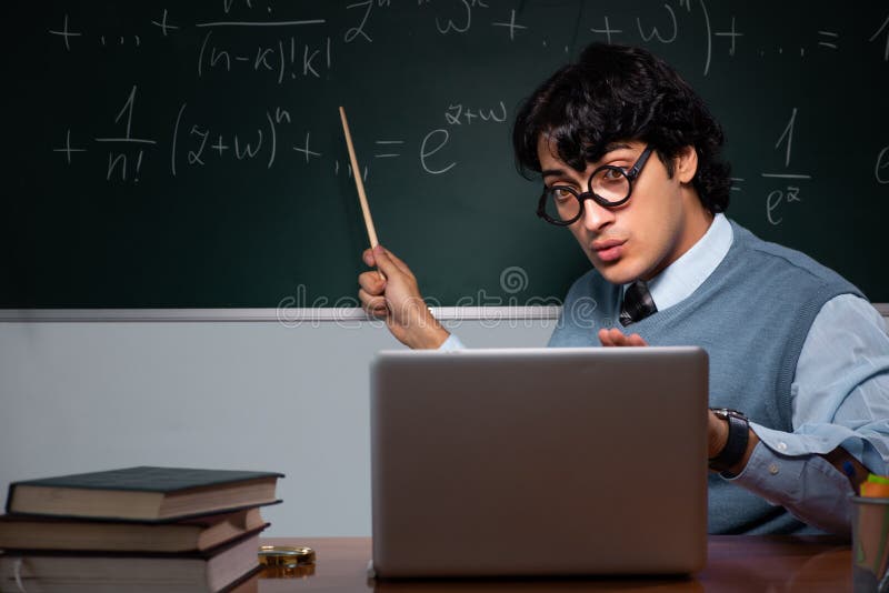 The Young Math Teacher in Front of Chalkboard Stock Image - Image of ...