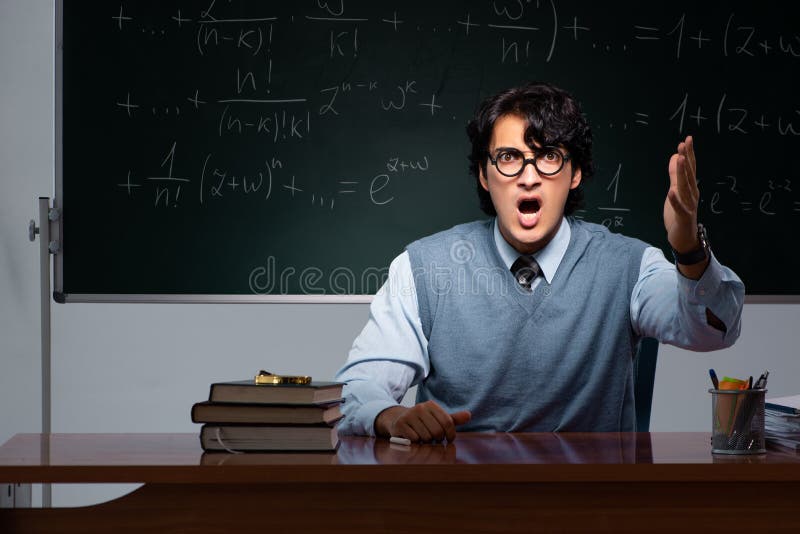 The Young Math Teacher in Front of Chalkboard Stock Photo - Image of ...