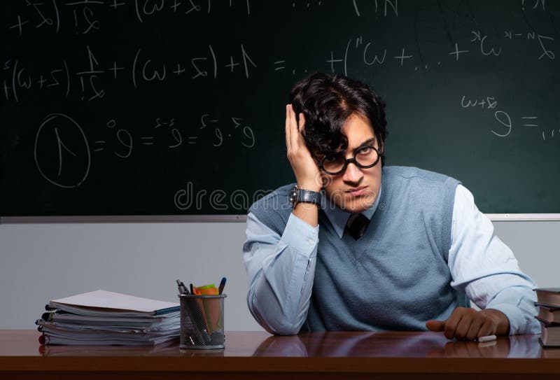 The Young Math Teacher in Front of Chalkboard Stock Photo - Image of ...