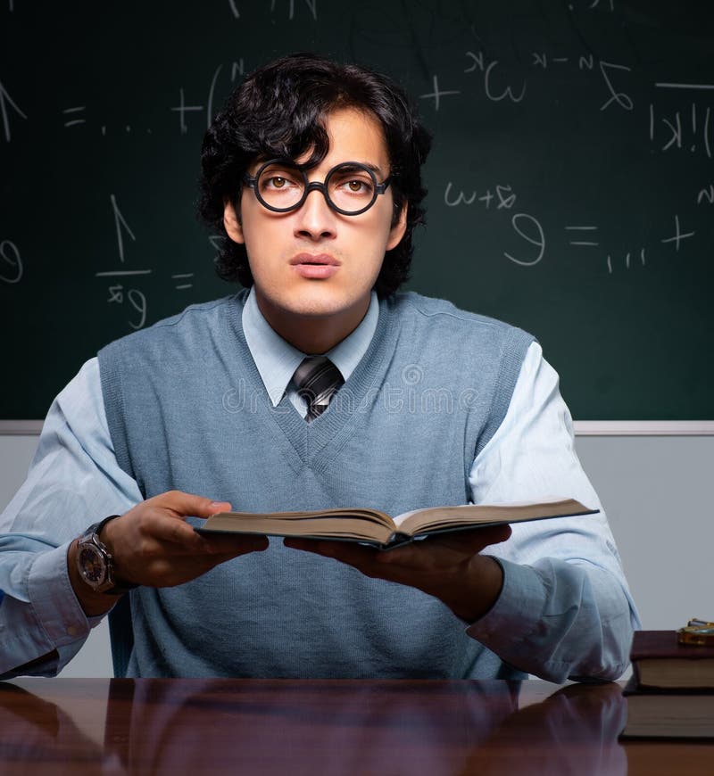 Young Math Teacher in Front of Chalkboard Stock Image - Image of back ...