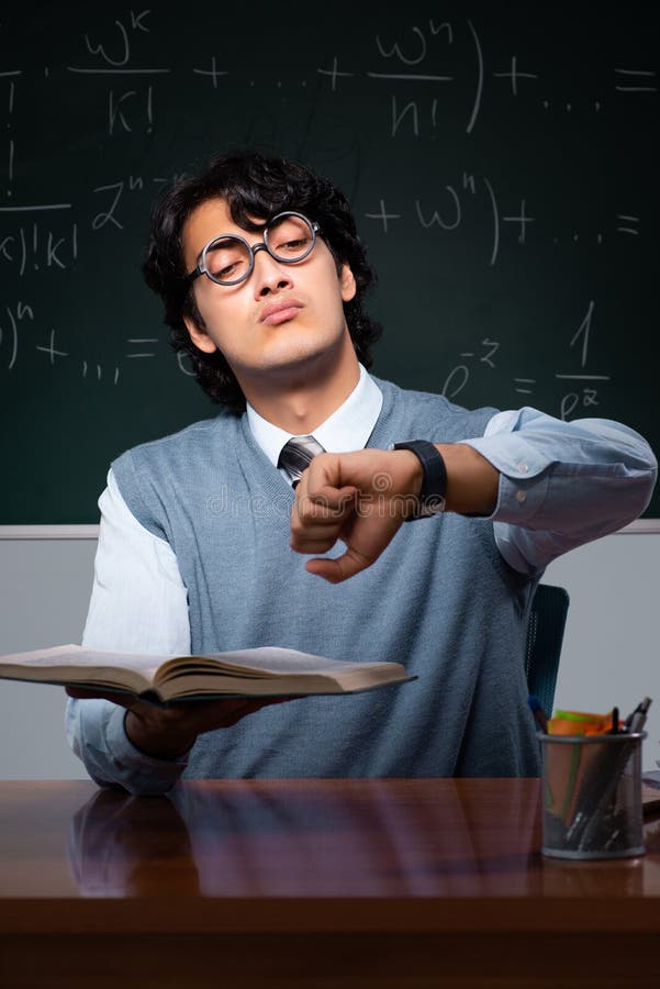 The Young Math Teacher in Front of Chalkboard Stock Image - Image of ...