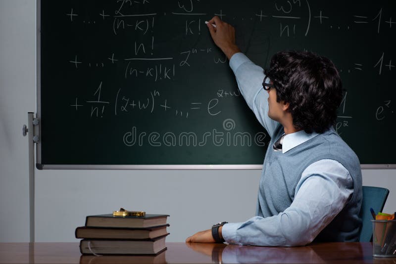 The Young Math Teacher in Front of Chalkboard Stock Image - Image of ...