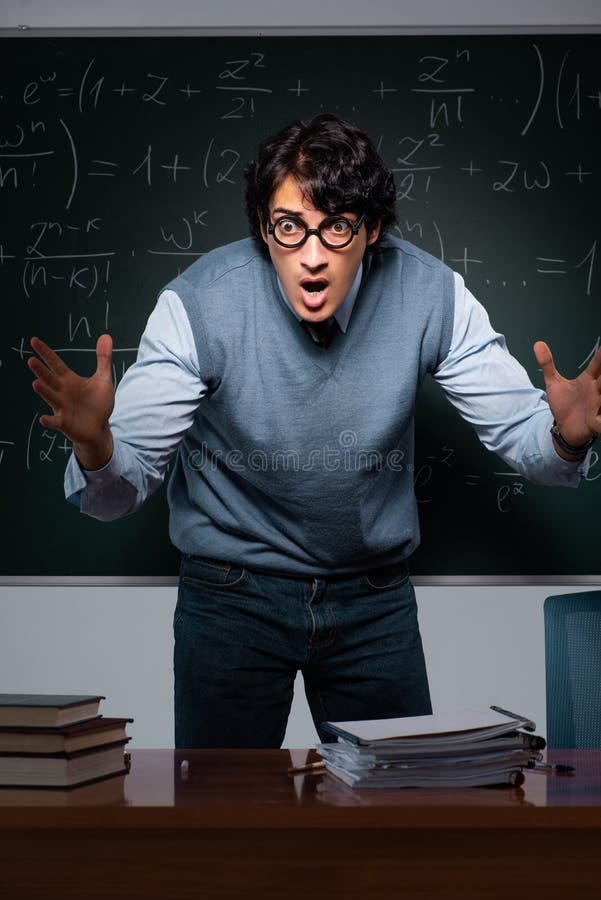The Young Math Teacher in Front of Chalkboard Stock Image - Image of ...