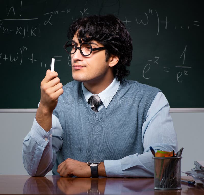 Young Math Teacher in Front of Chalkboard Stock Photo - Image of chalk ...