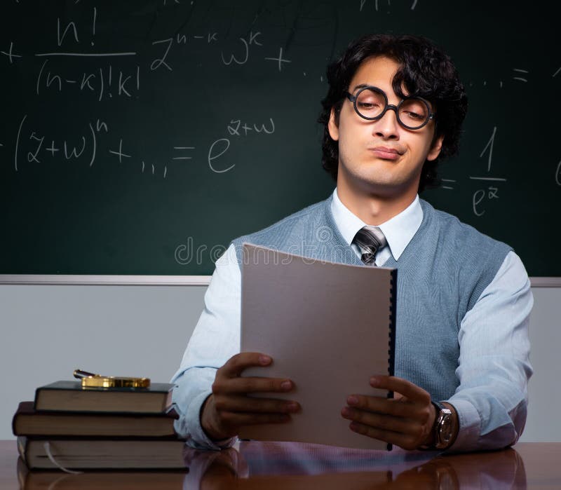 Young Math Teacher in Front of Chalkboard Stock Photo - Image of ...