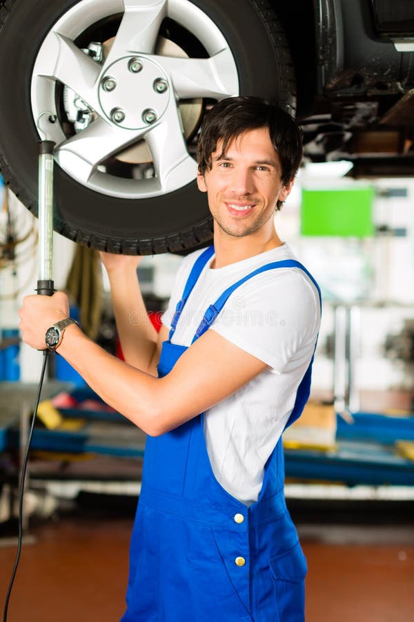 Young Mechanic in Blue Overall Working on Car Stock Photo - Image of ...