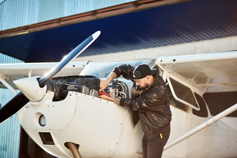 Mechanic Engineer Inspecting Light Single-engine Propeller Airplane ...