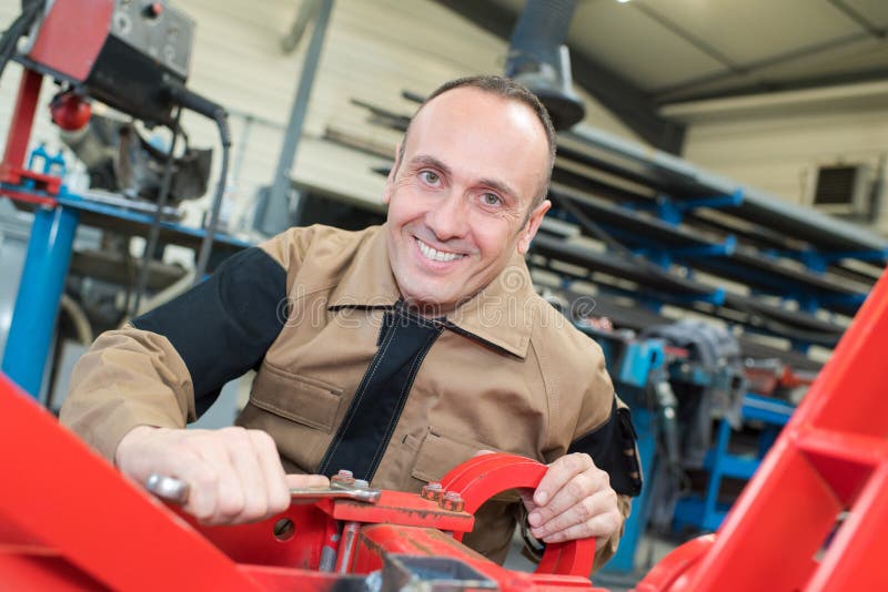 Young Mechanic Fixing Plow on Tractor Stock Photo - Image of thirties ...