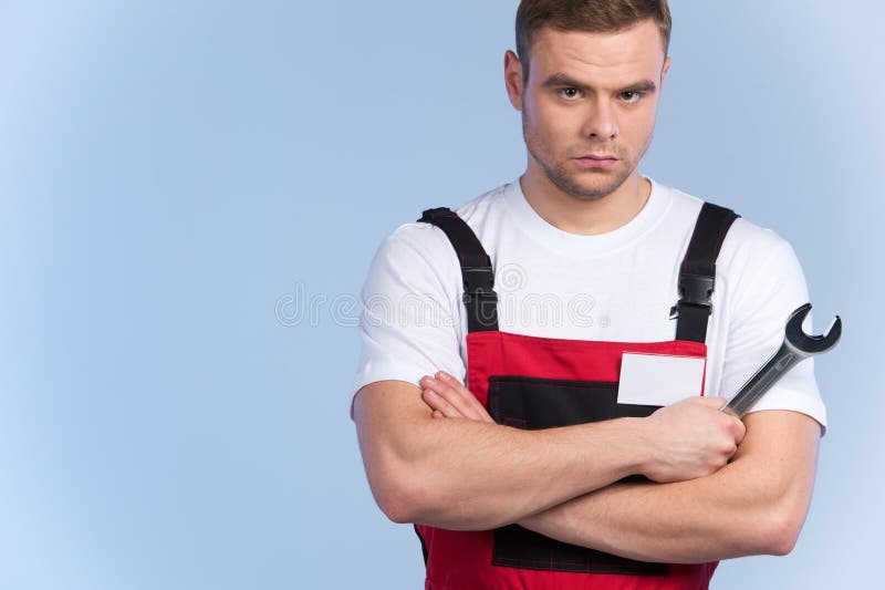 Serious Young Mechanic Red Overall Blue Background Stock Photos - Free ...