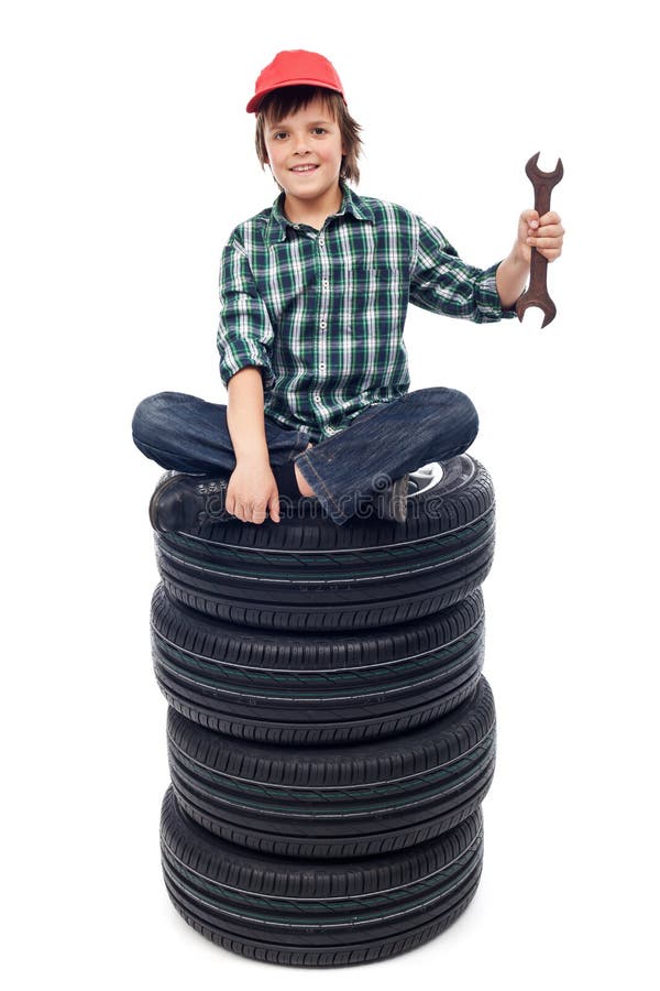 Young Mechanic with Tires and Spanner Stock Photo - Image of help ...