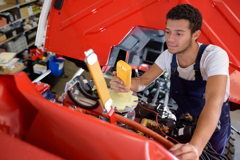 Young mechanic at work stock photo. Image of male, fixing - 173518010