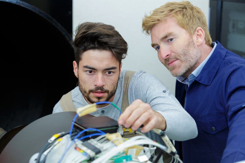 Young Mechanical Assembler Inspecting Wires at Rotor Stock Image ...