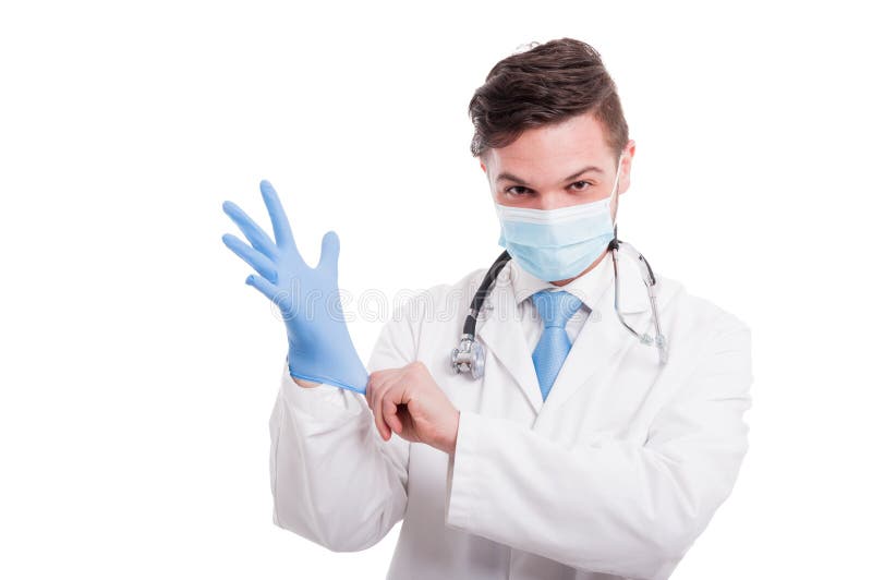 Young Doctor Pulling Surgical Gloves Stock Photos - Free & Royalty-Free ...