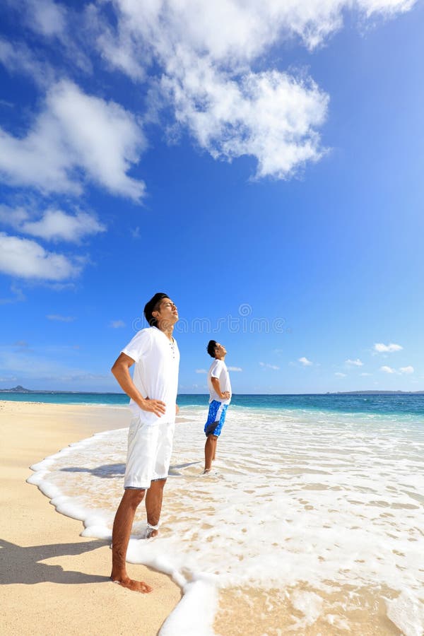 Young men on beach stock photo. Image of human, male - 58346330
