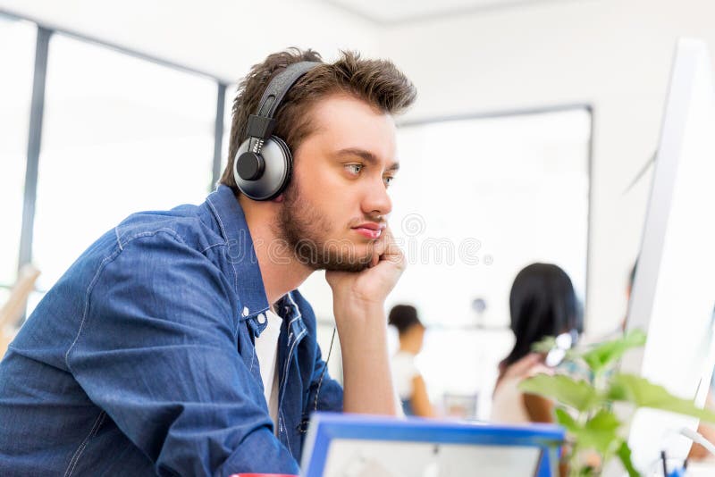 Young Man Working in Office Stock Photo - Image of happy, creative ...