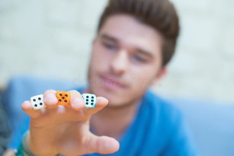 Young Man with Dice between Fingers Stock Image - Image of human, lucky ...