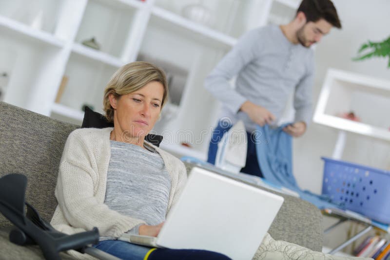 Young man doing housework stock image. Image of happy - 223792345
