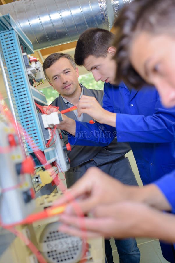 Young Men Doing Work on Panel Board Stock Photo - Image of teach ...