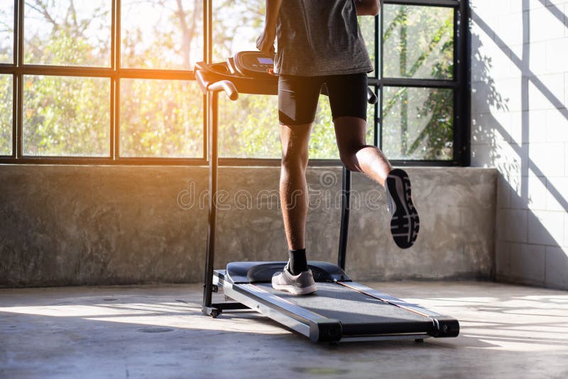 Young Men Exercise on an Automatic Treadmill Stock Image - Image of ...