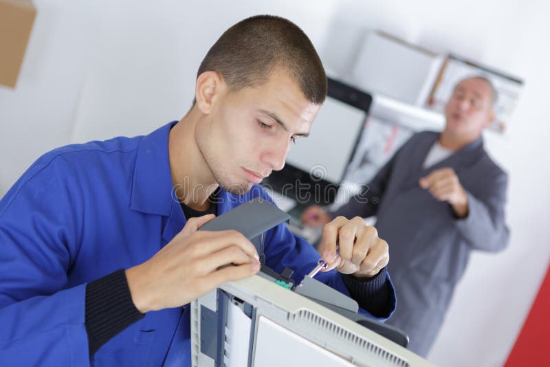 Young Man Fixing Printing Machine Stock Image - Image of occupation ...