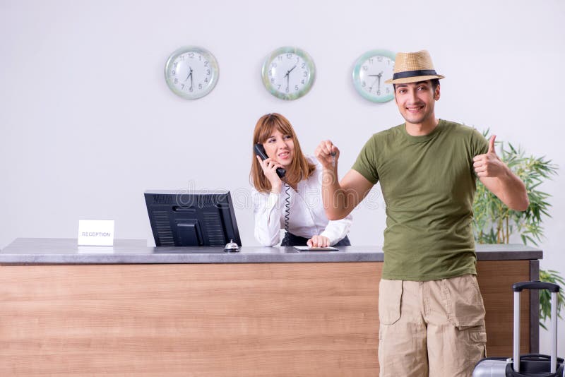 Young Man at the Hotel Reception Stock Photo - Image of checking ...