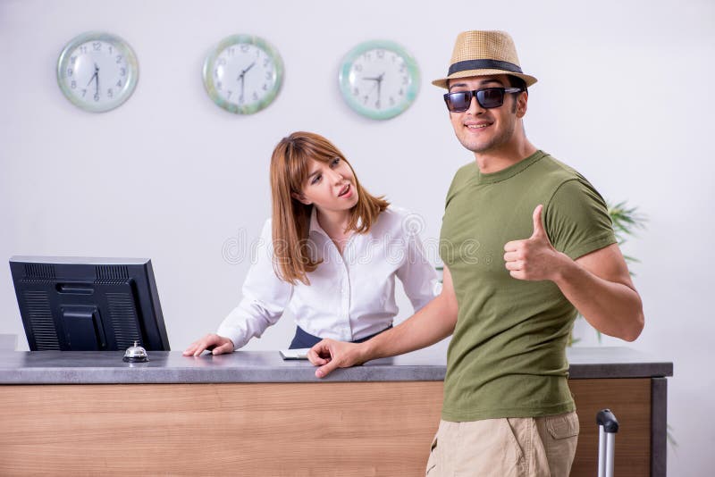 Young Man at the Hotel Reception Stock Image - Image of businessman ...