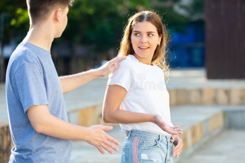 Young Man is Initiating a Conversation with Girl Stock Image - Image of ... Young Man is Initiating a Conversation with Girl Stock Image - Image of ...