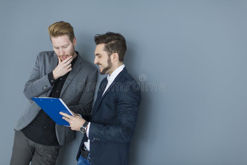 Young men in the office stock image. Image of folder - 53162417