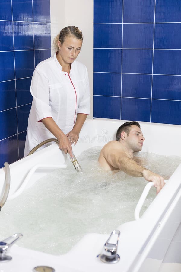 Young Man is the Procedure in the Whirlpool Hydrobath Stock Image ...