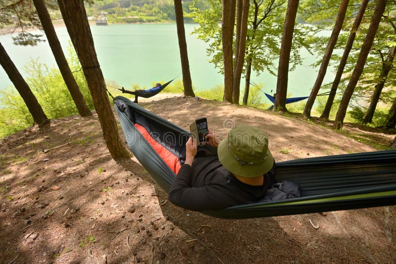 Young Men Relaxing in Hammock Tree Stock Photo - Image of happiness ...