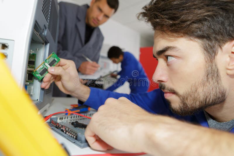 Young Man Repairs Electronic Device Stock Image - Image of industrial ...