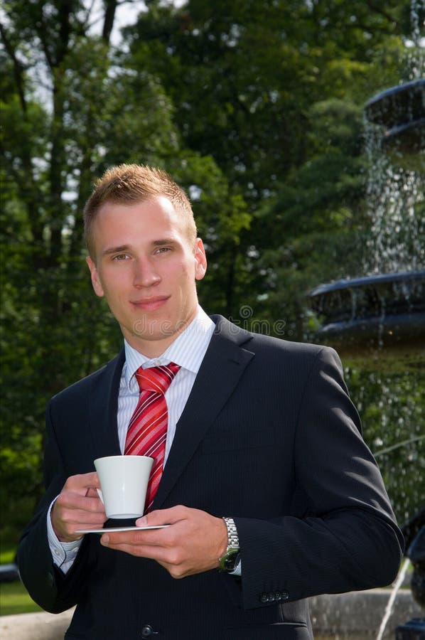 Young Men in Suit with a Cup Stock Photo - Image of caucasian, office ...