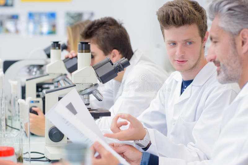 Young Men and Teacher Inside Lab Stock Photo - Image of teaching ...