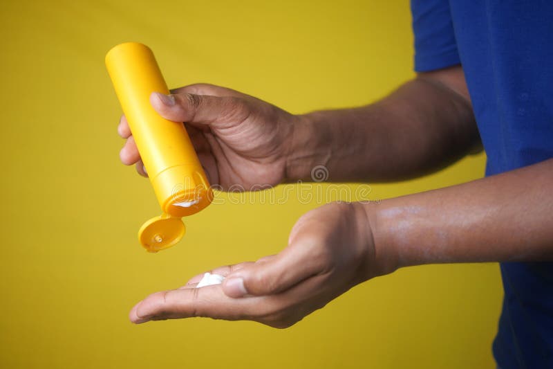 Young Men Using Sunscreen Cream Stock Photo - Image of indoor ...