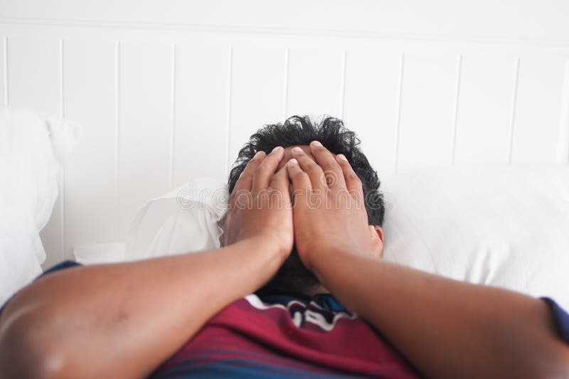 Young Men Waking Up from Sleep in Bed Stock Photo - Image of sleep ...