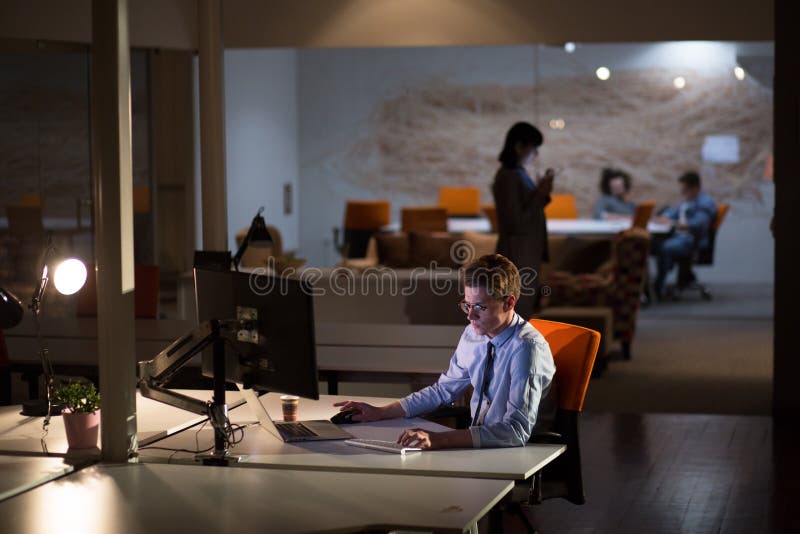 Man Working on Computer in Dark Office Stock Photo - Image of monitor ...
