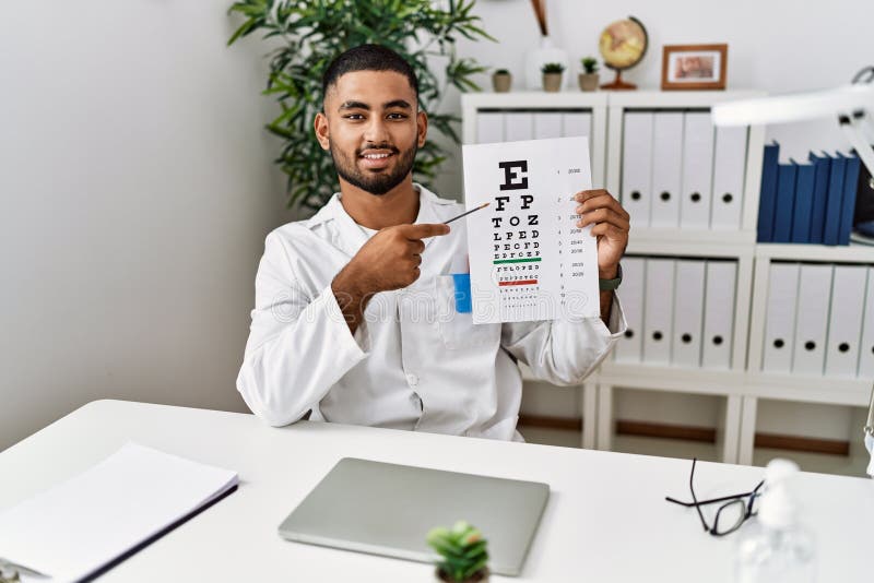Young Middle East Man Wearing Optician Uniform Testing Vision at Clinic ...